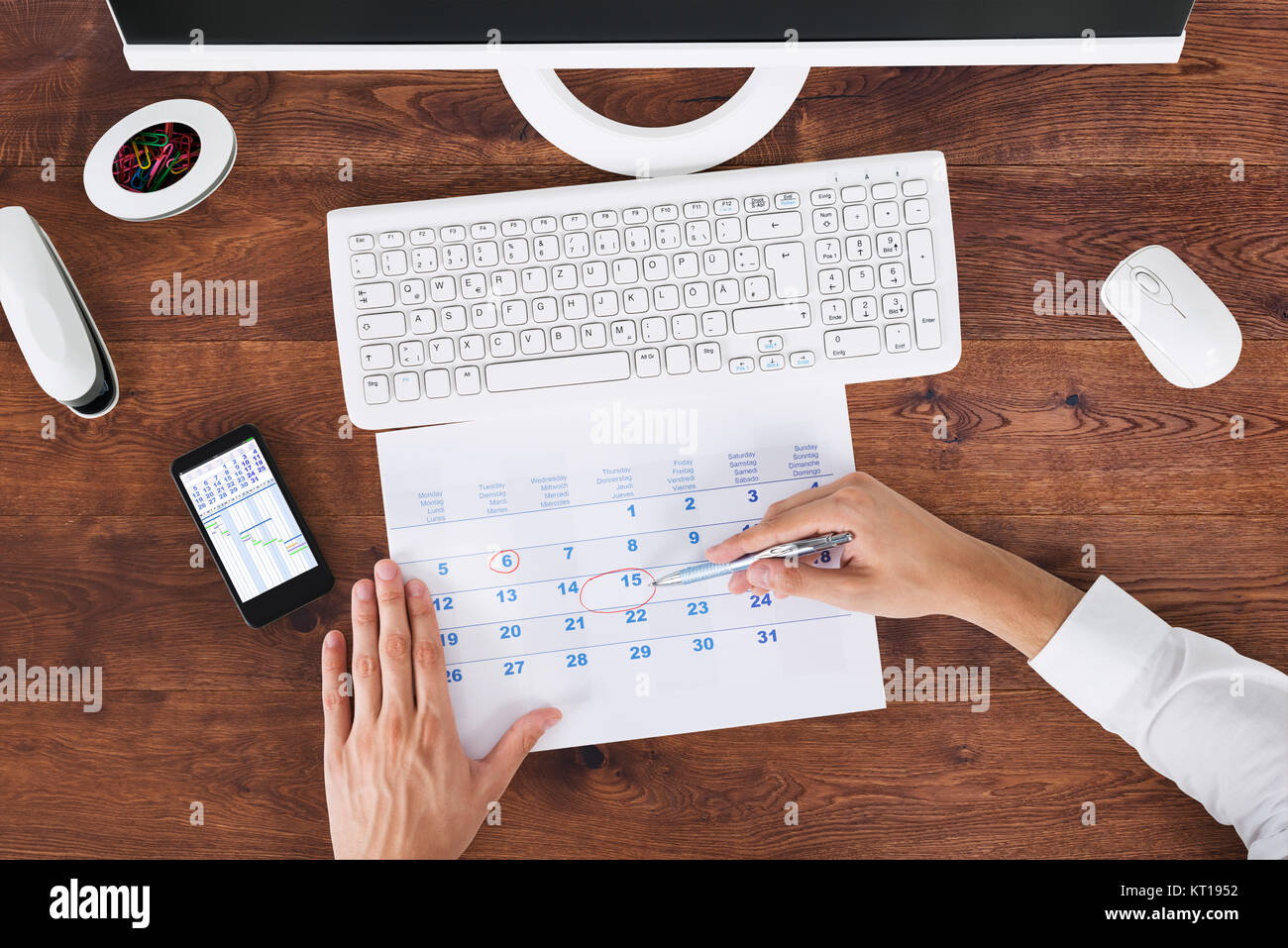 Businessman Marking Date On Calendar Stock Photo - Alamy