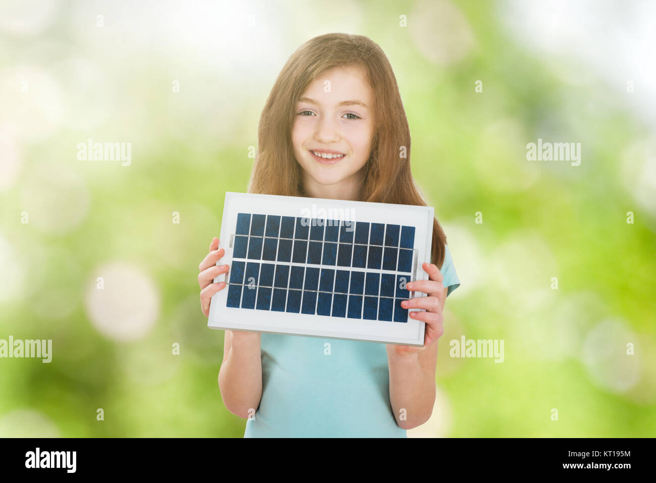 Smiling Girl Holding Solar Panel Stock Photo - Alamy