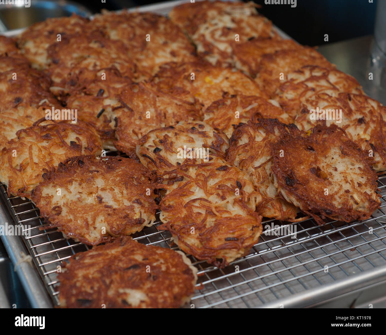 Hash browns on a cooling rack Stock Photo - Alamy