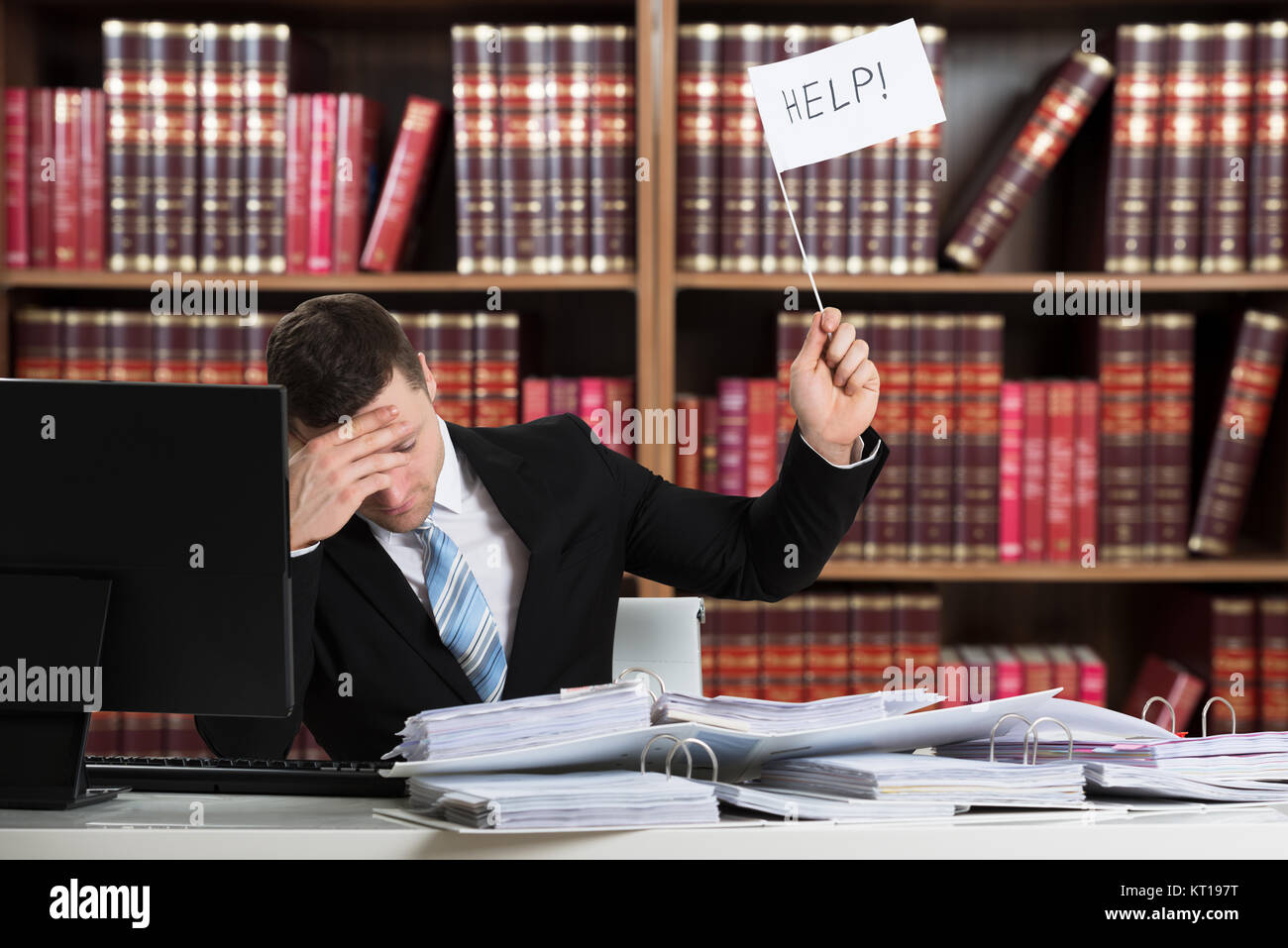 Overworked Accountant Holding Help Sign At Desk Stock Photo - Alamy