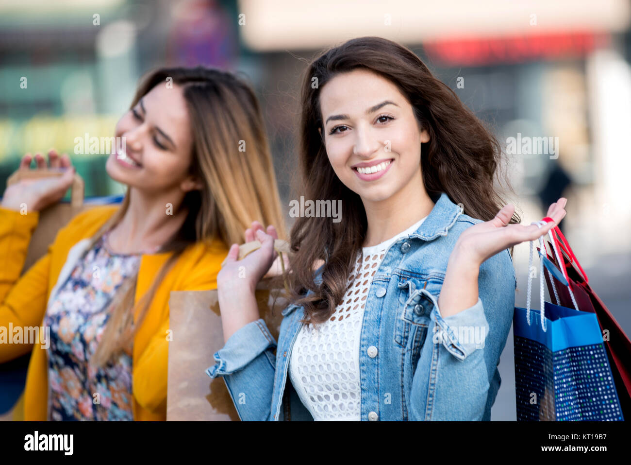 Happy girls shopping in late autumn. bags, walking, holidays Stock ...