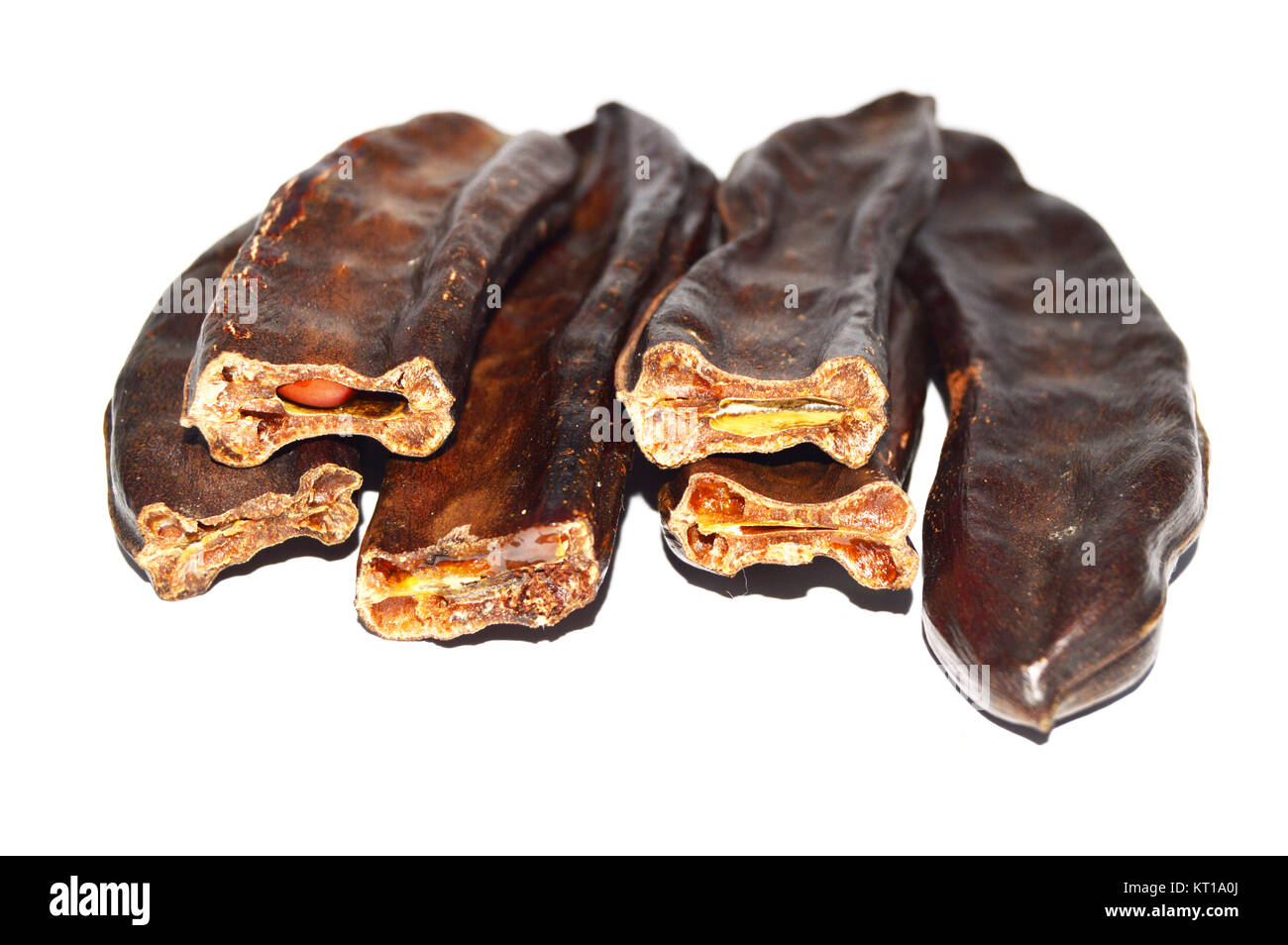 Dried carob fruit close up Cut Out Stock Images & Pictures - Alamy