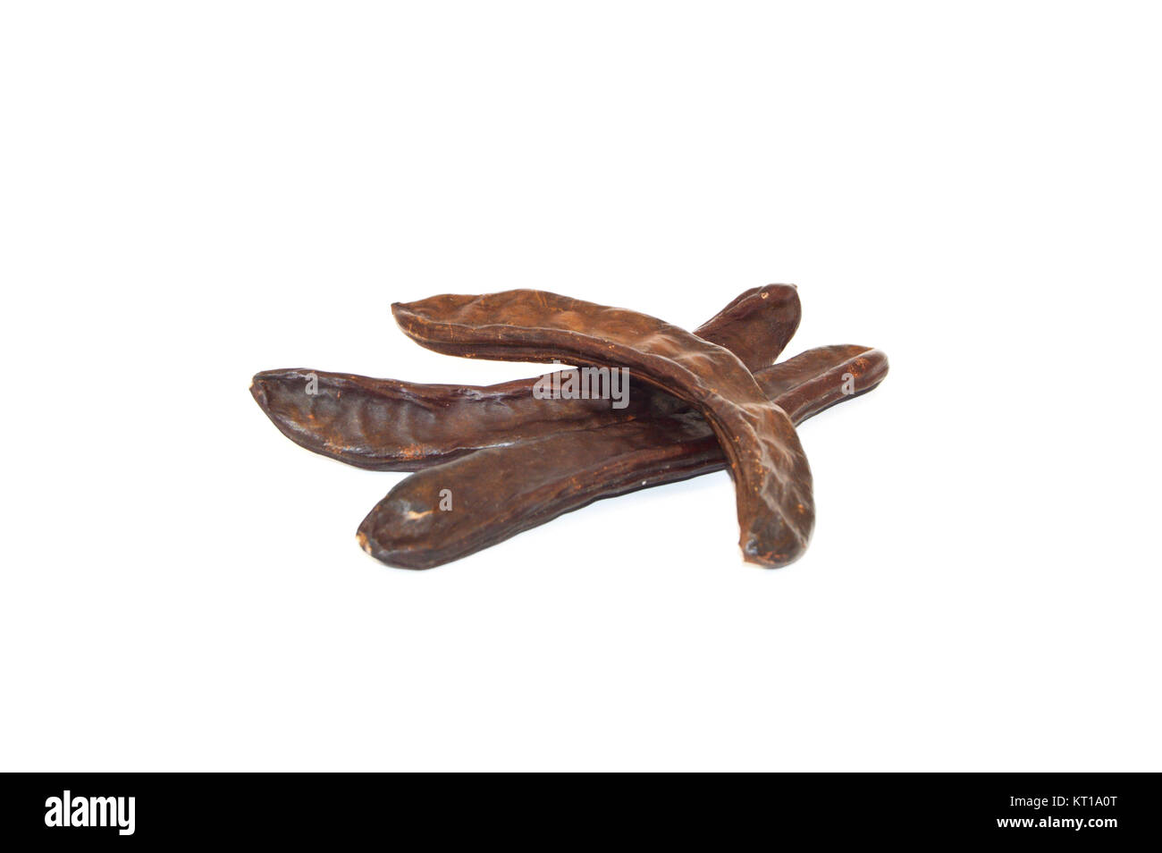 Dried carob fruit close up Cut Out Stock Images & Pictures - Alamy
