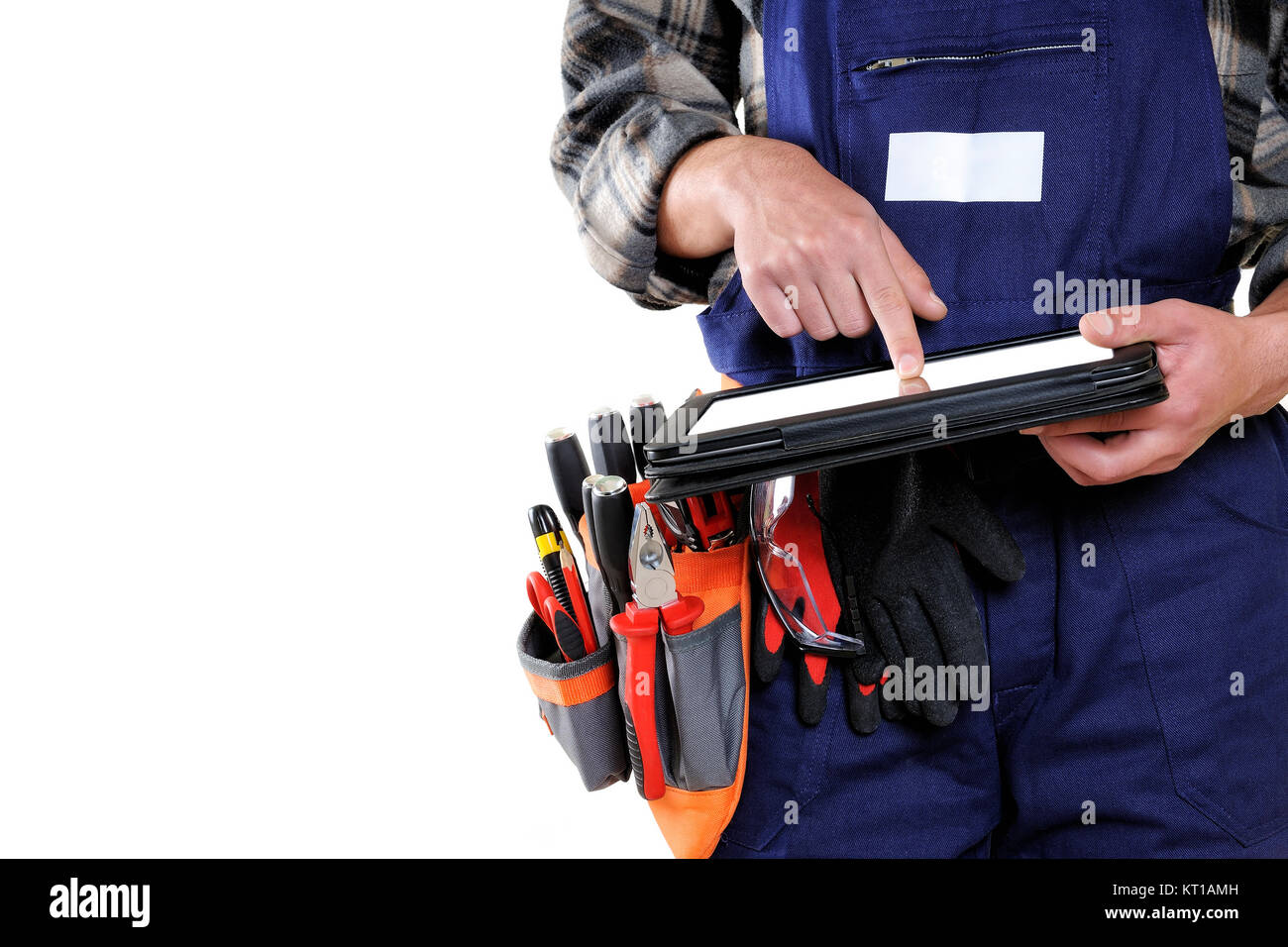 Young electrician technician consults the laptop isolated on white ...