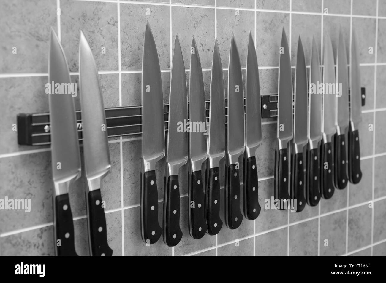 Knife rack on a wall Stock Photo - Alamy