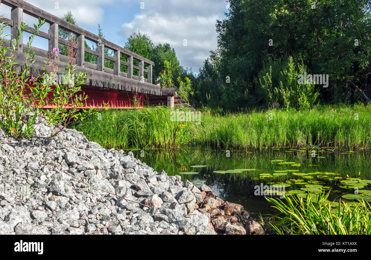 Wooden Bridge Over The River Stock Photo - Alamy