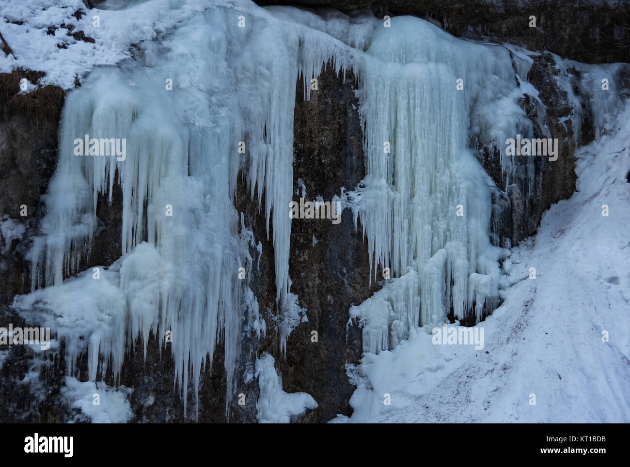 icicles of frozen waterfall in a dark rocky ravine Stock Photo - Alamy