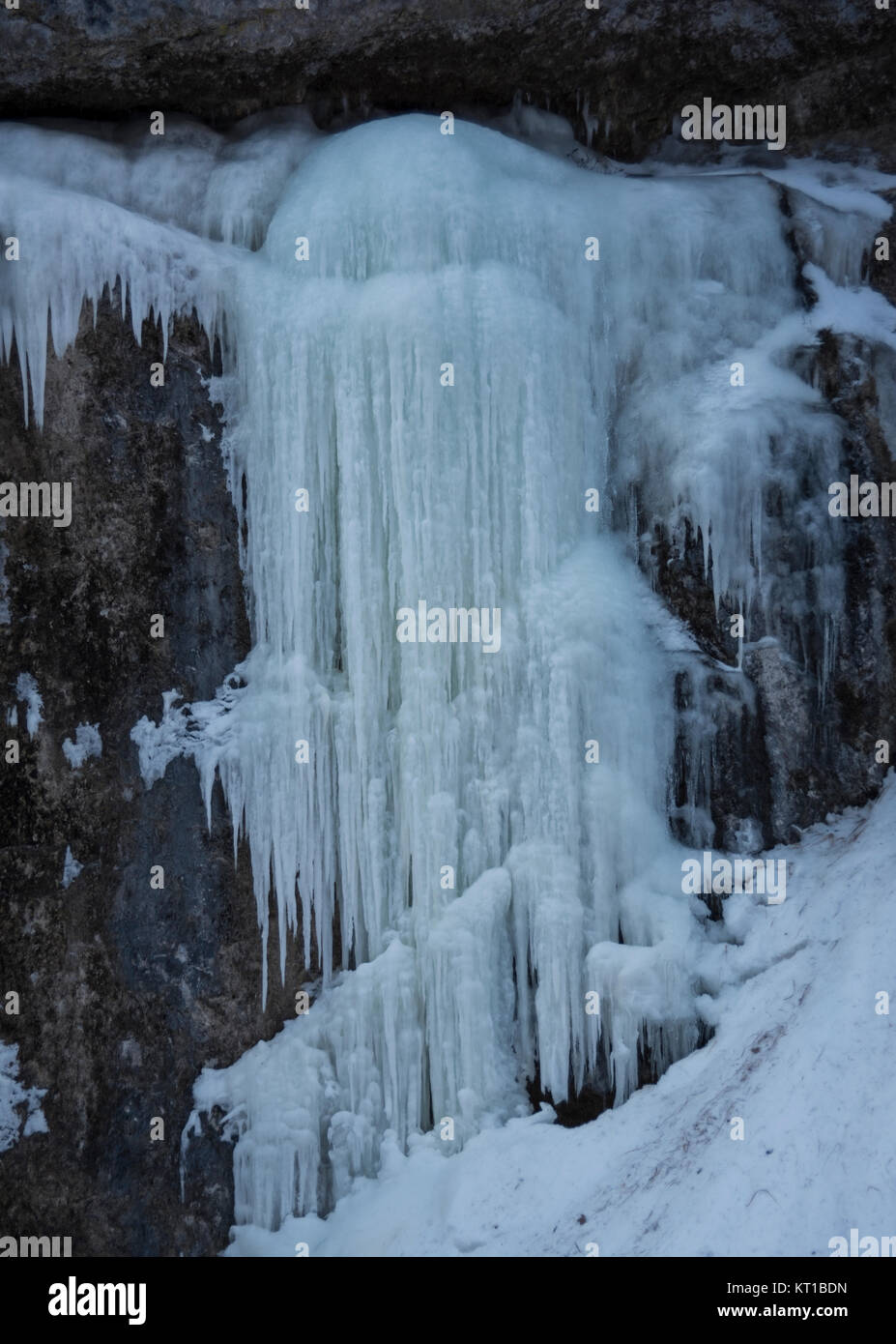 icicles of frozen waterfall in a dark rocky ravine Stock Photo - Alamy