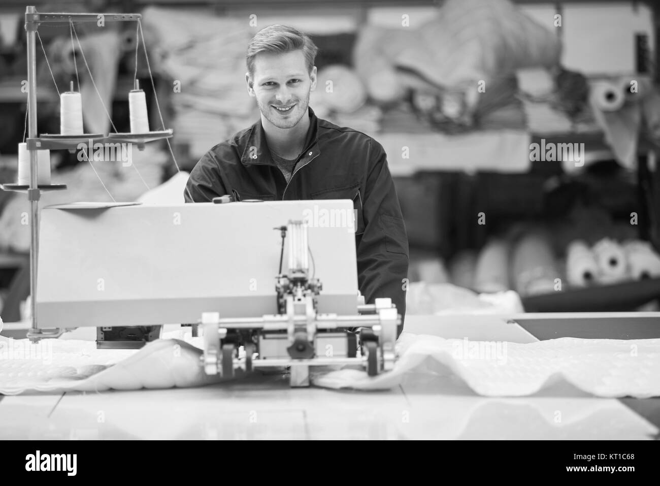 worker in protective clothing in factory using machine Stock Photo - Alamy