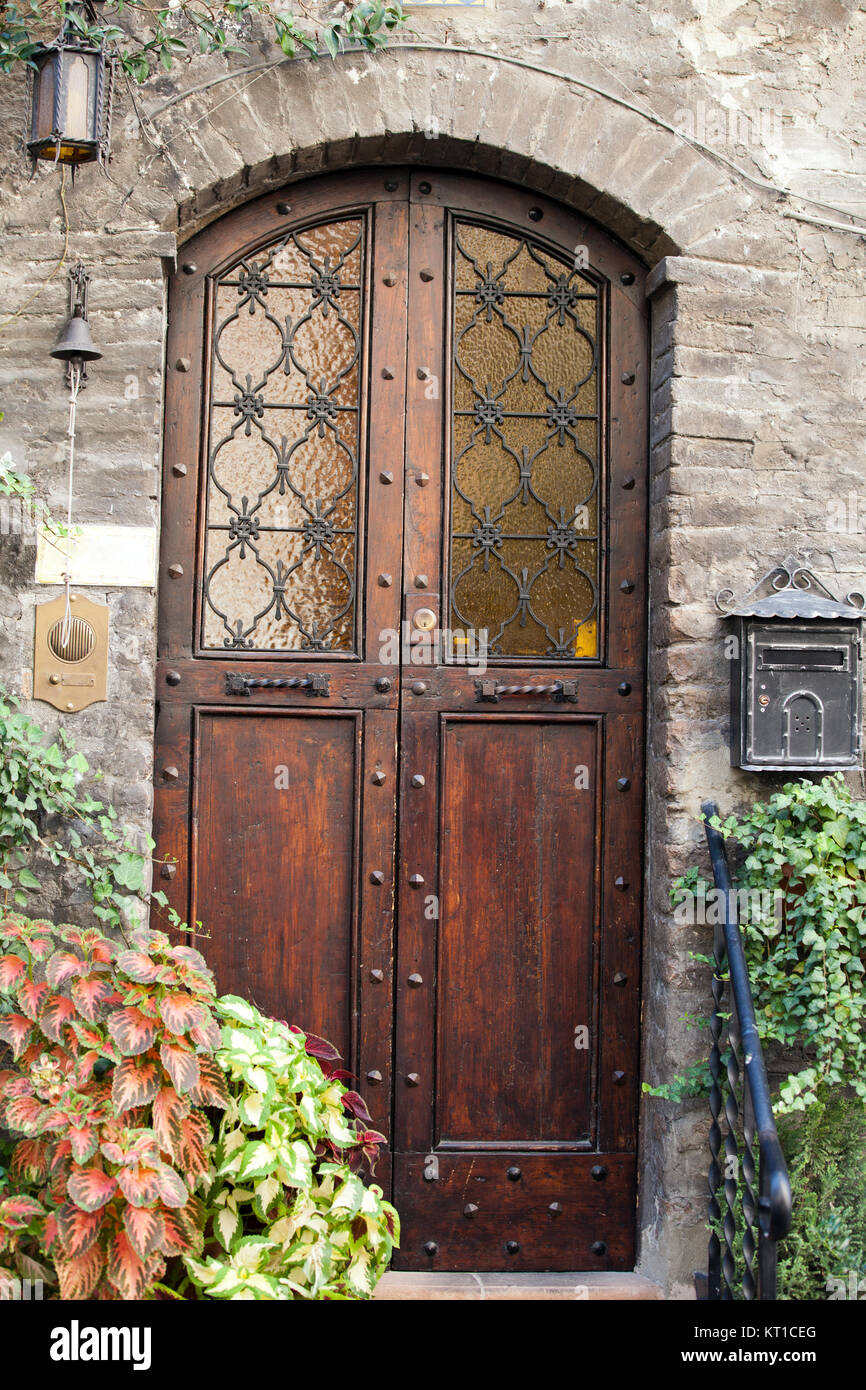 Flowers in pots on the stone steps medieval house in Assisi Stock Photo ...