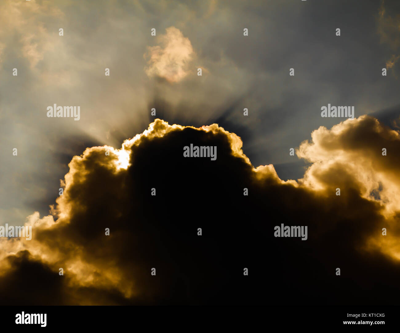 Sun shine through rain cloud Stock Photo - Alamy