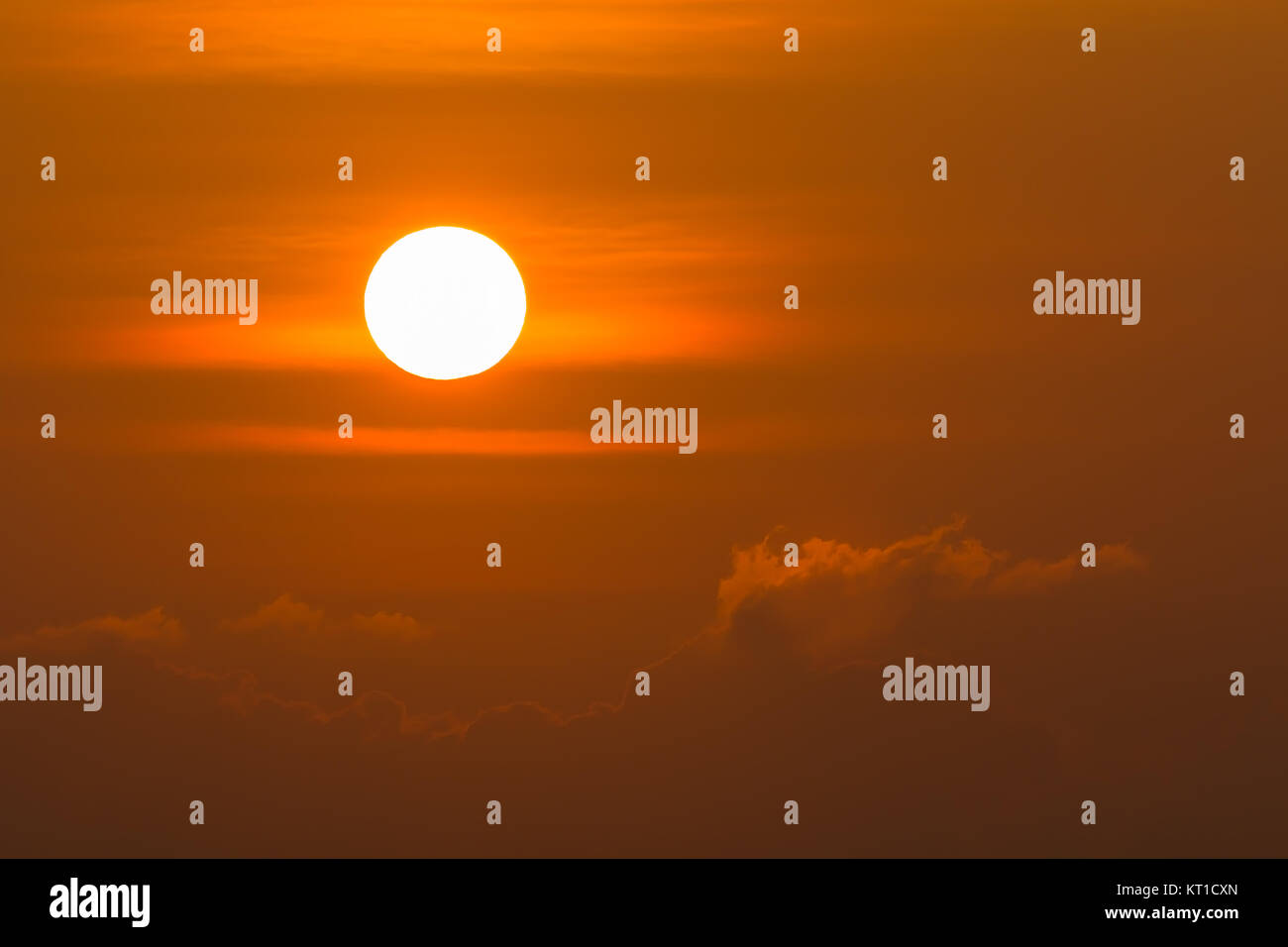 Sunrise over clouds with bright yellow sun on a morning Stock Photo - Alamy