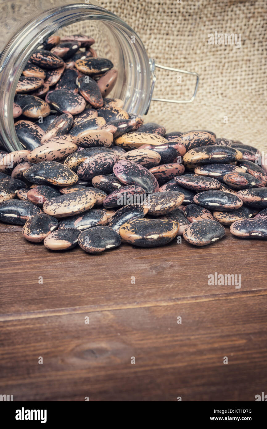 Vintage photo of spilled beans from lying glass. Vertically Stock Photo ...