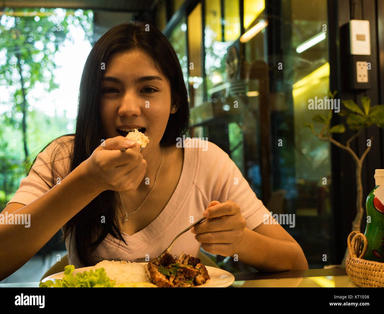 Asian woman eatting a dinner Stock Photo - Alamy