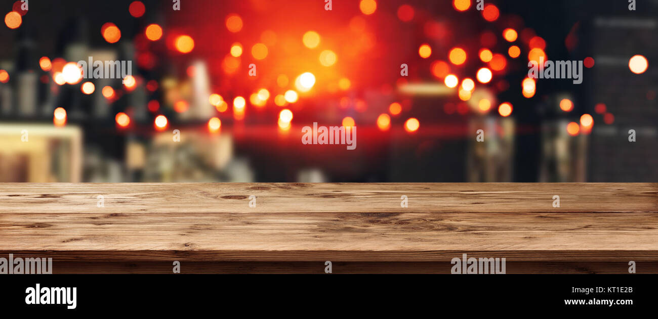 Panorama background for a pub at night in front of an empty wooden ...