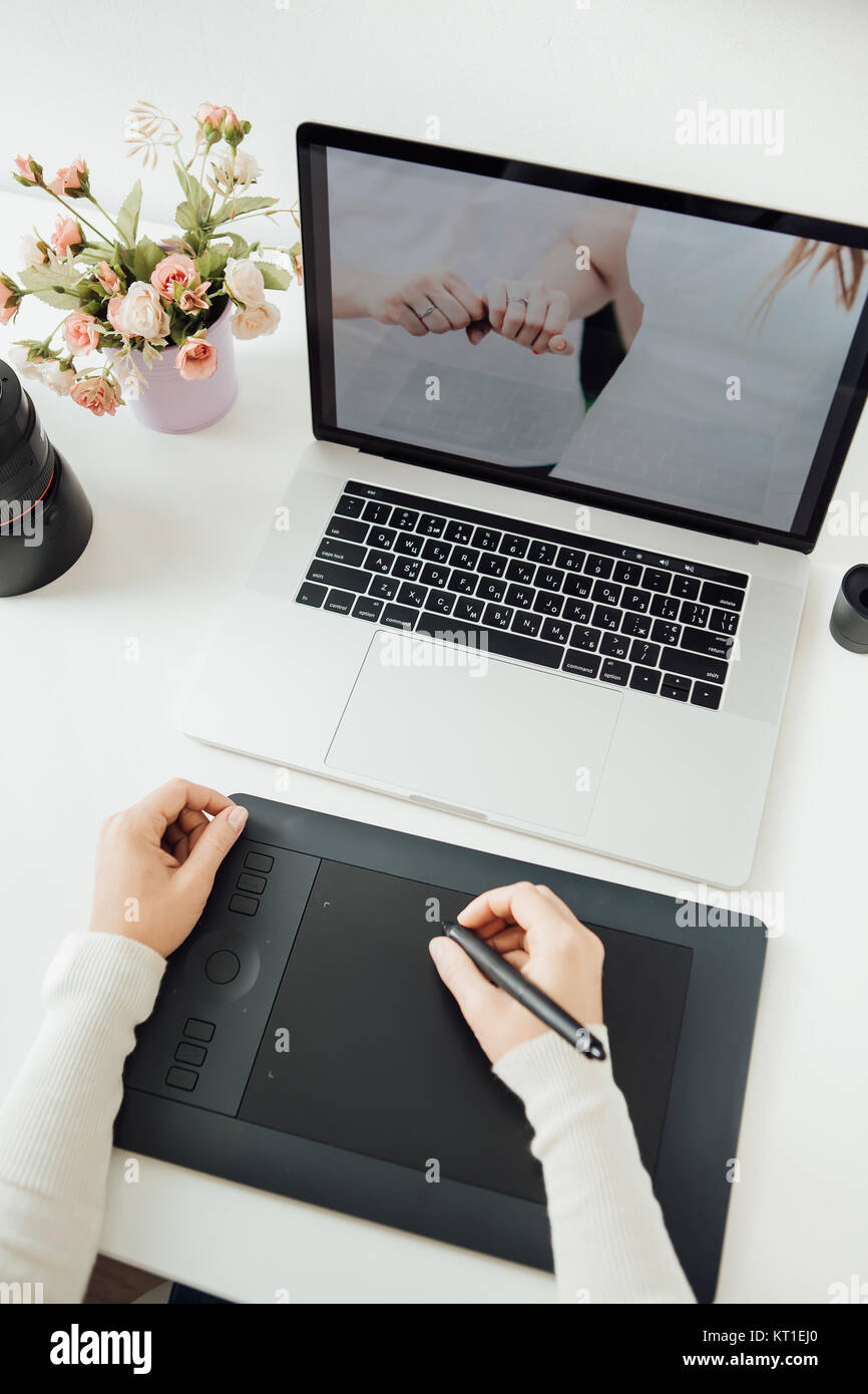 retouching on computer laptop Stock Photo - Alamy