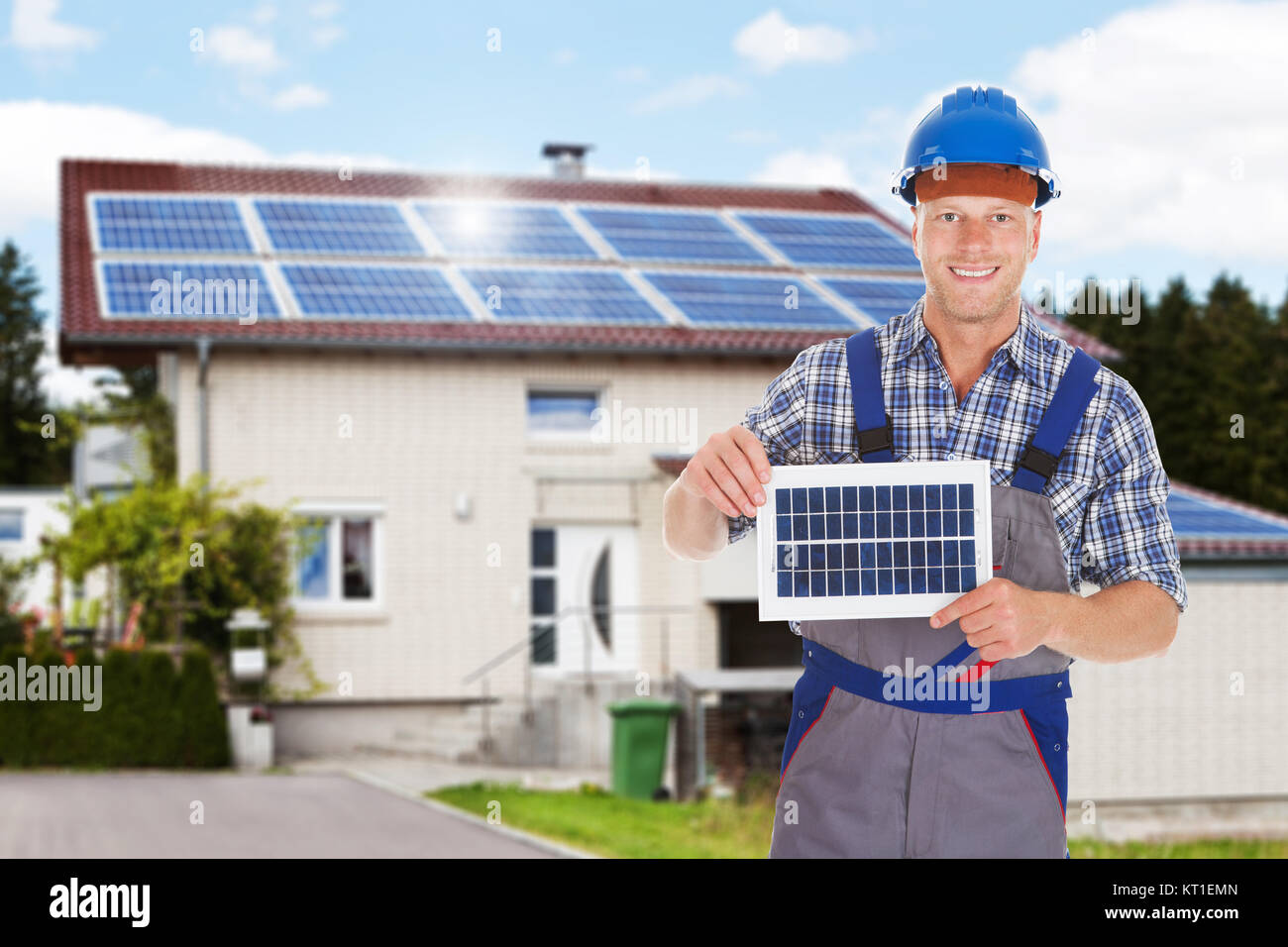 Smiling Repairman Holding Solar Panel Stock Photo - Alamy