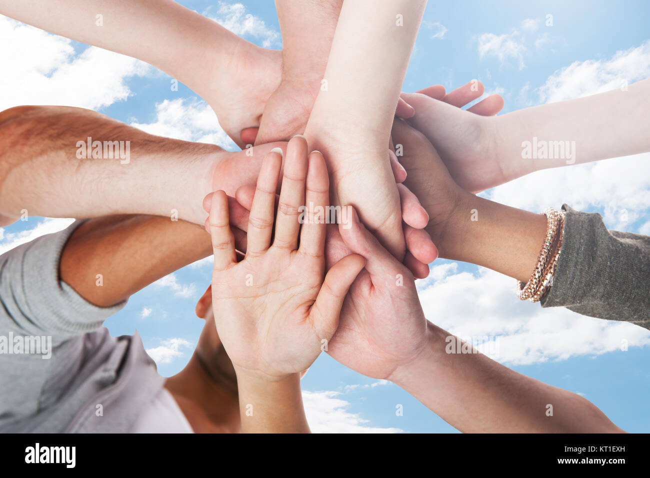Young College Students Stacking Hands Stock Photo - Alamy