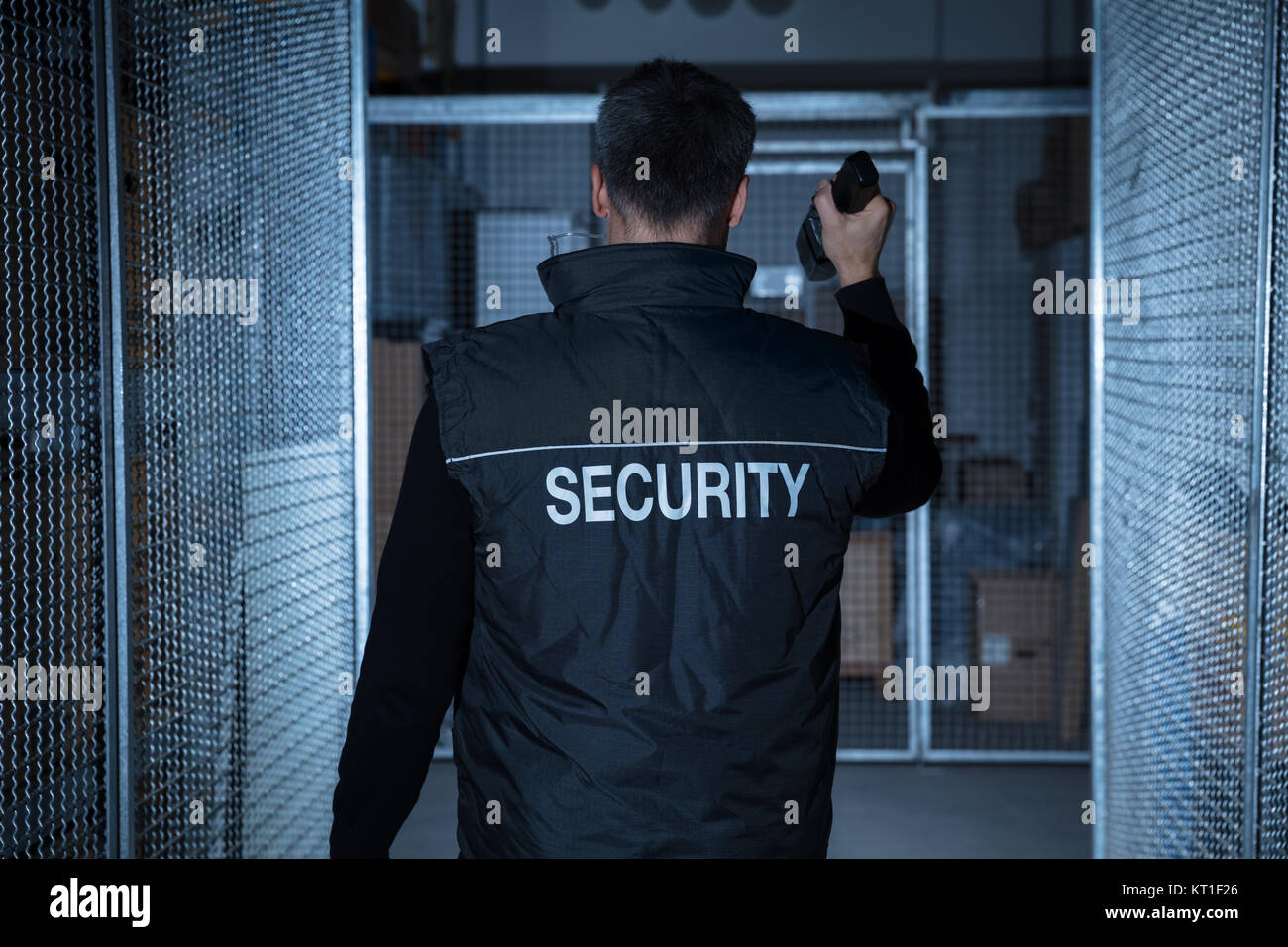 Security Guard Standing In The Warehouse Stock Photo - Alamy