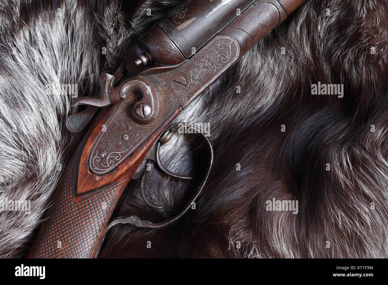 Ancient hunting shotgun closeup on nice fur background Stock Photo - Alamy