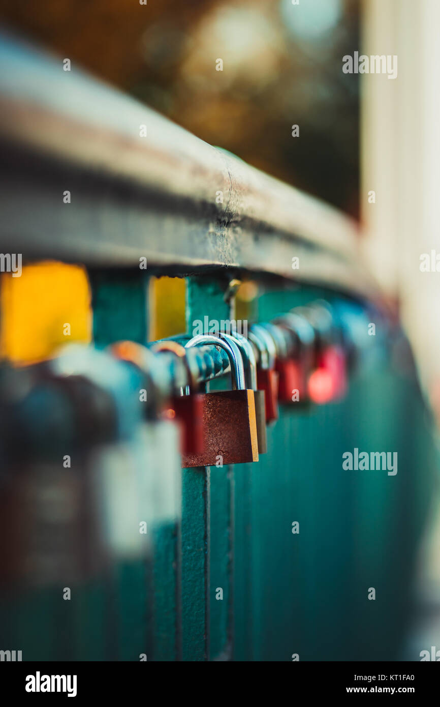 Colorful locks on a bridge, put there by couples in love. Taken in ...