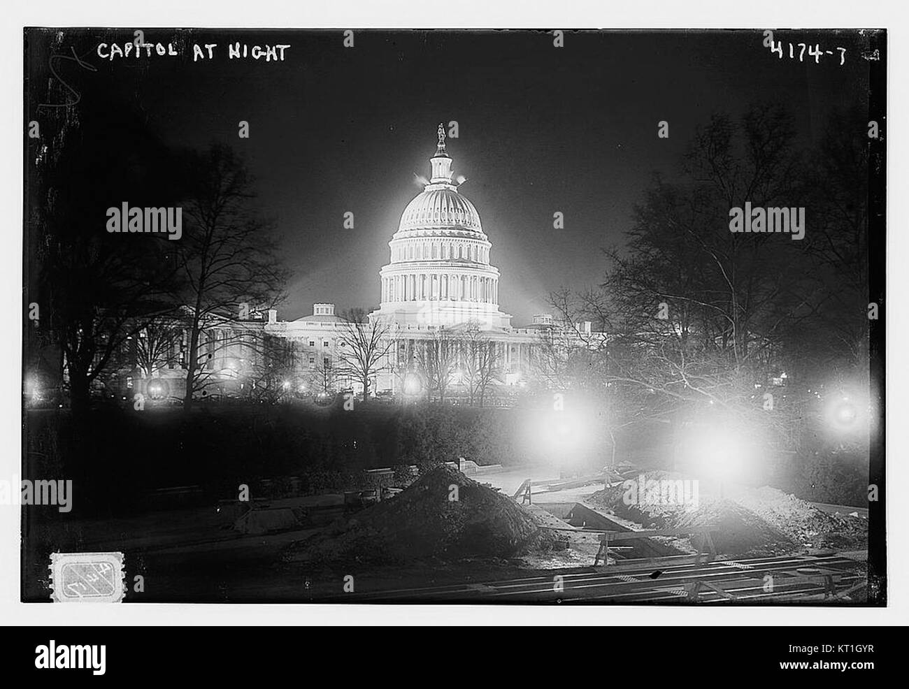 A striking image of the U.S. Capitol Building illuminated at night. The ...