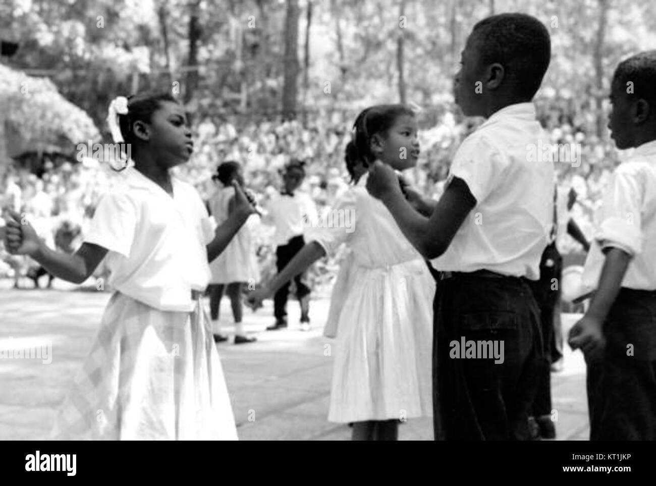 A group of children can be seen playing a game called Zoodio Zoodio, a ...