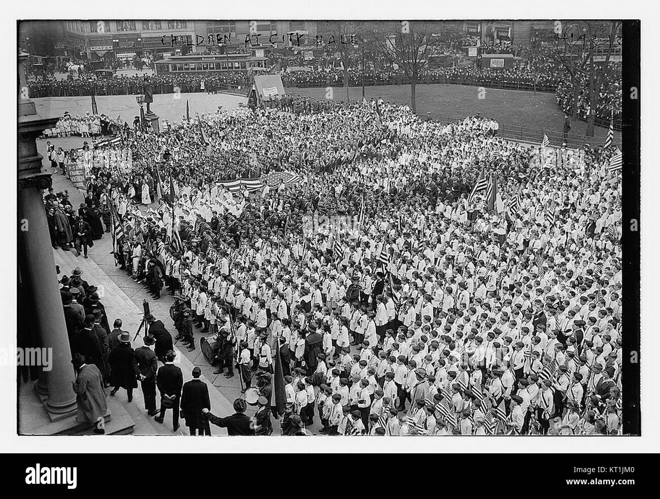 This photograph captures children at City Hall, likely involved in a ...