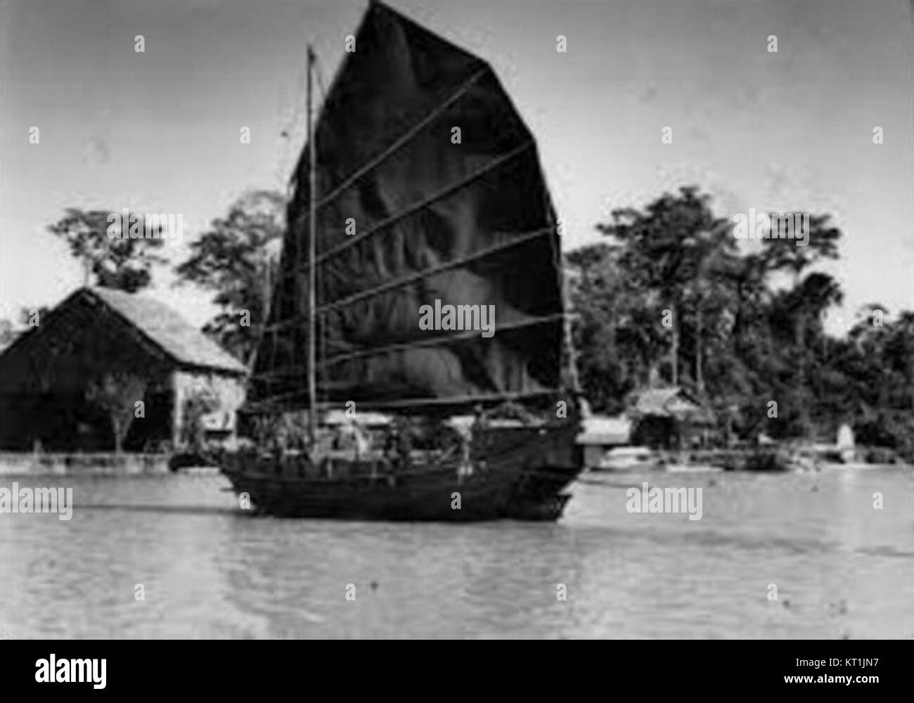 A photograph of a Chinese junk, a type of traditional sailing vessel ...