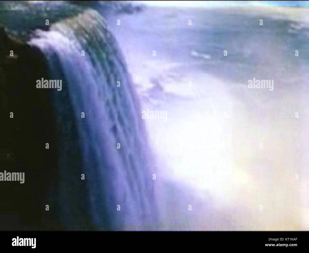 A historical image showing a Niagara Falls trailer at the edge of the ...