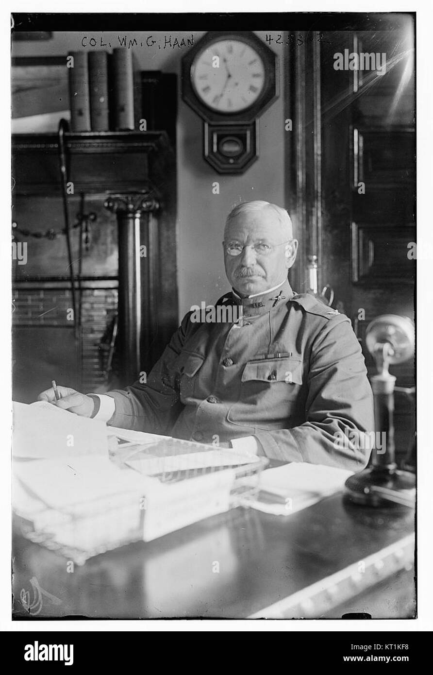 This photograph captures Colonel William G. Haan, a military figure ...