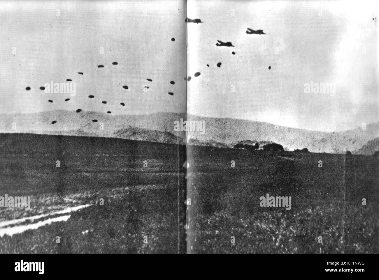 This historical image depicts the parachute landing of the 4th Brigade ...