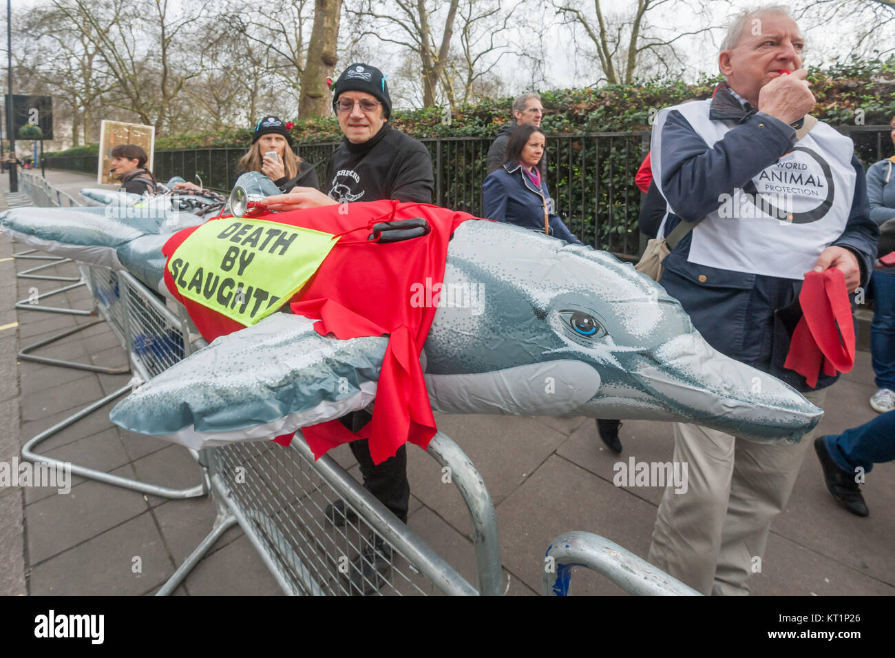 'Death by Slaughter' is the message on this inflatable dolphine at the ...