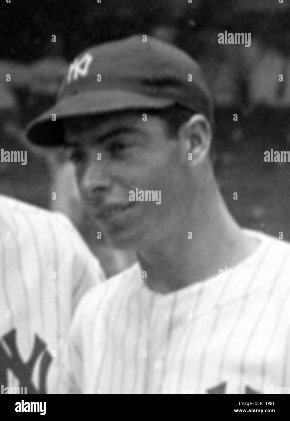 This cropped image shows Joe DiMaggio, a famous American baseball ...