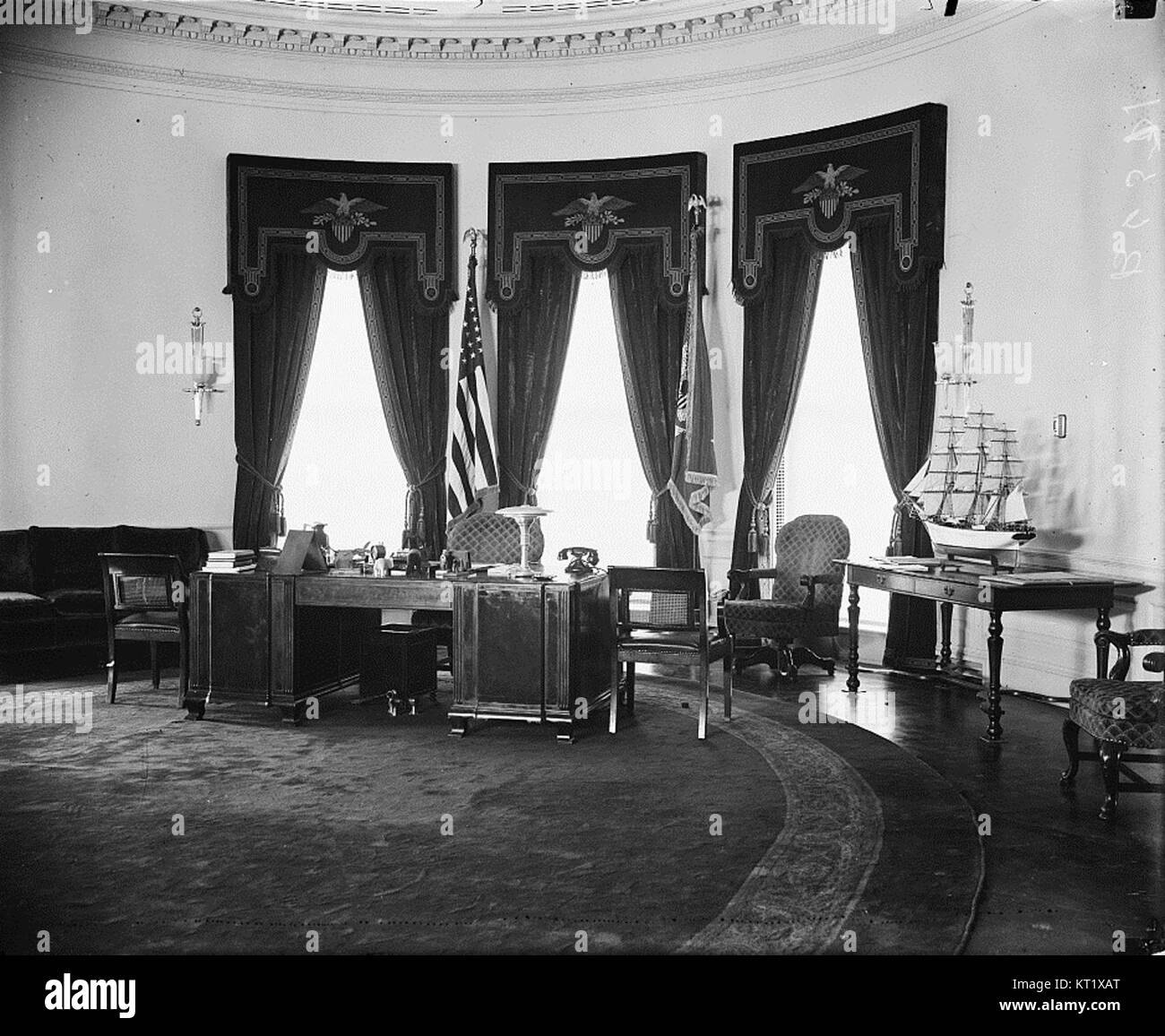 The image depicts President Franklin D. Roosevelt in the Oval Office in ...