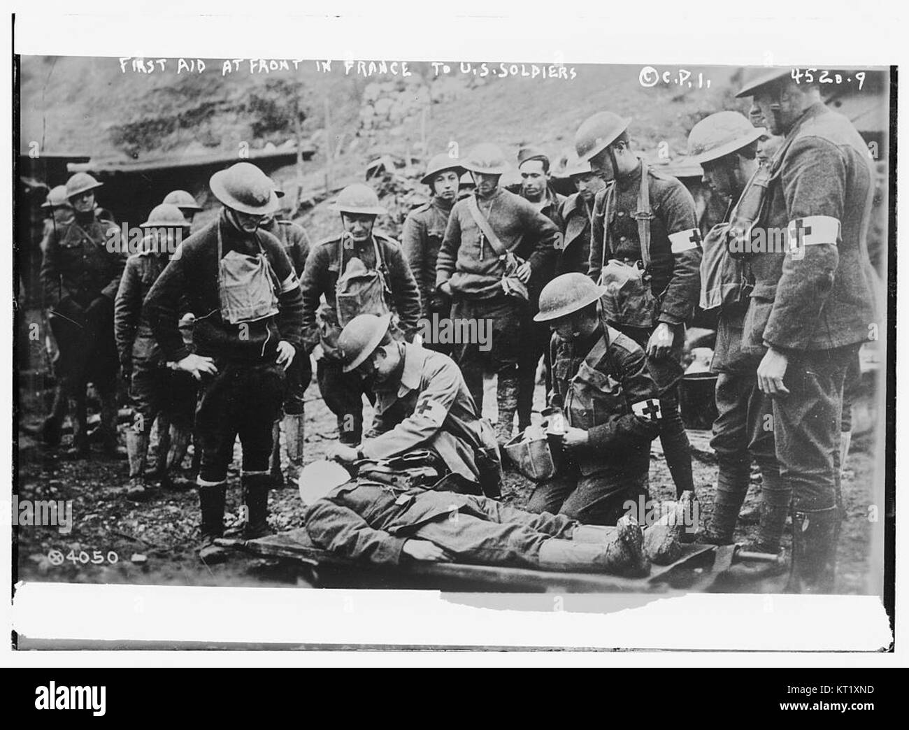This image shows first aid being administered to U.S. soldiers at the ...
