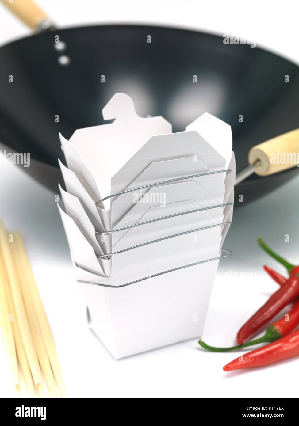 A Chinese takeaway container and a wok isolated against a white ...