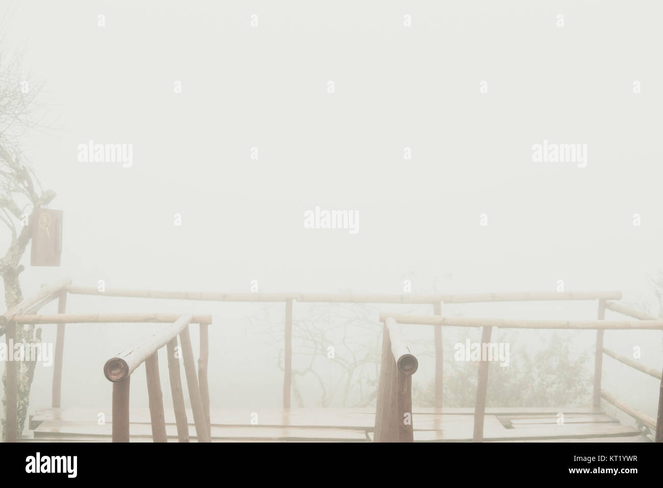 wood balcony in mist in morning. bamboo terrace in fog Stock Photo - Alamy