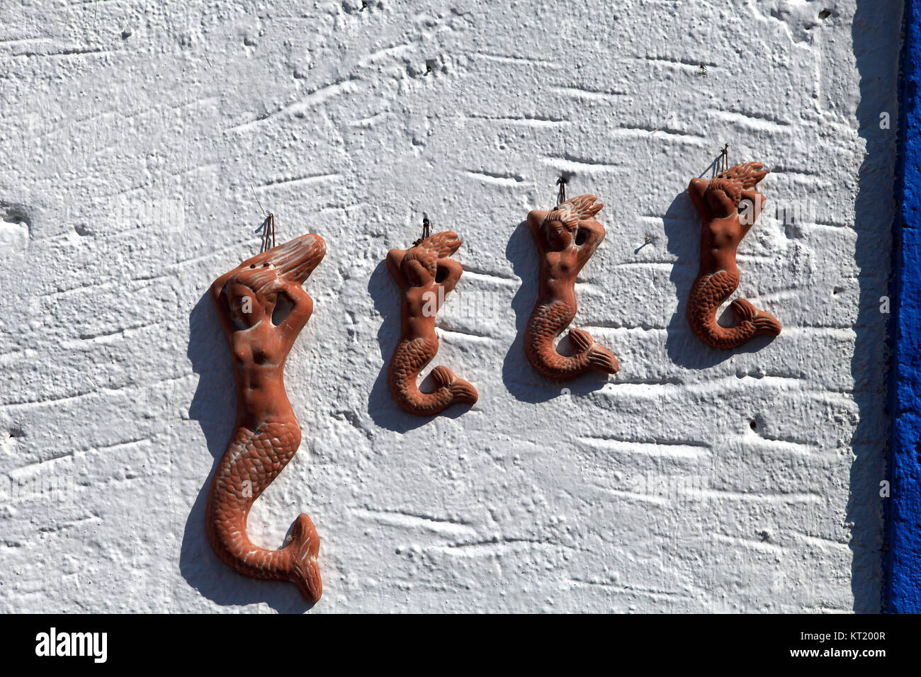 Ceramic siren against the white wall Stock Photo - Alamy