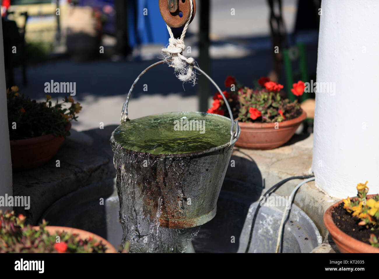 Lessons from the well bucket of refreshing water Stock Photo - Alamy