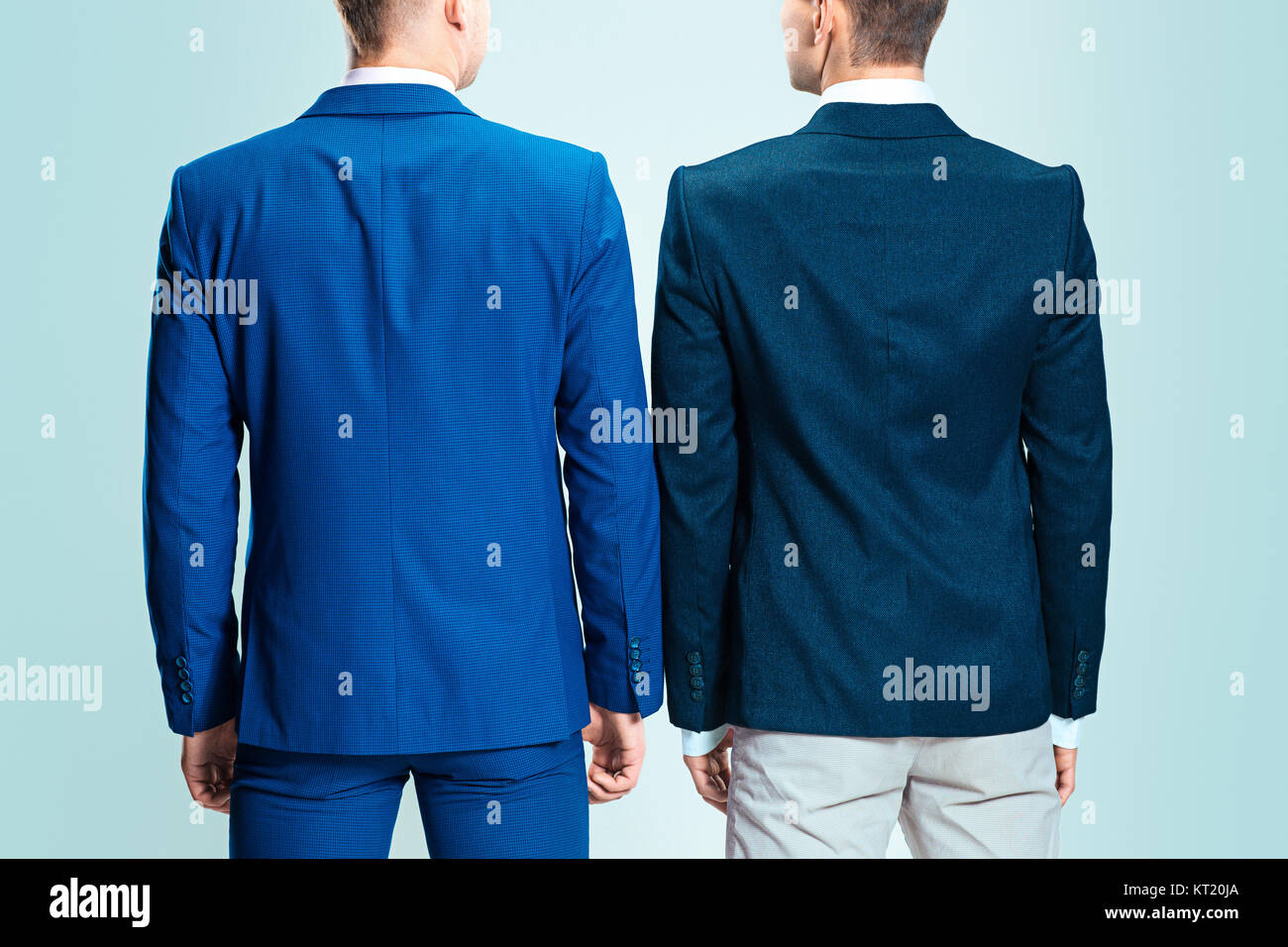 Two young stylish men in a suit. Rear view from the back Stock Photo ...
