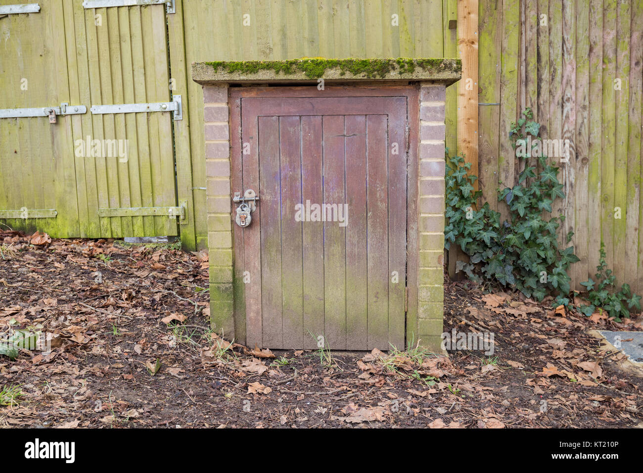 Door for a underground path in the woods Stock Photo - Alamy