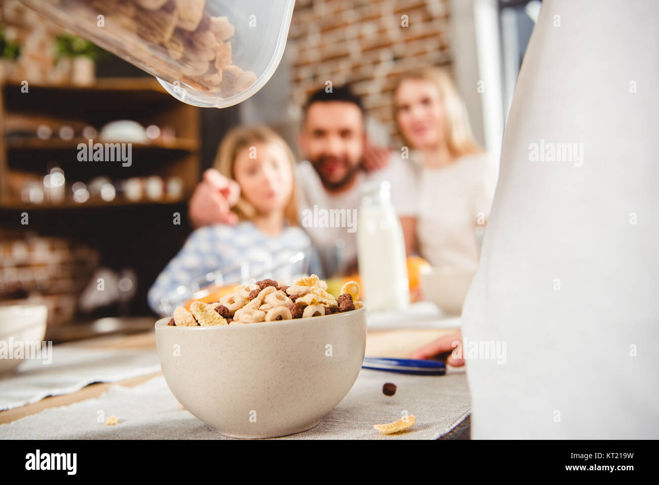 Pouring corn flake rings Stock Photo - Alamy