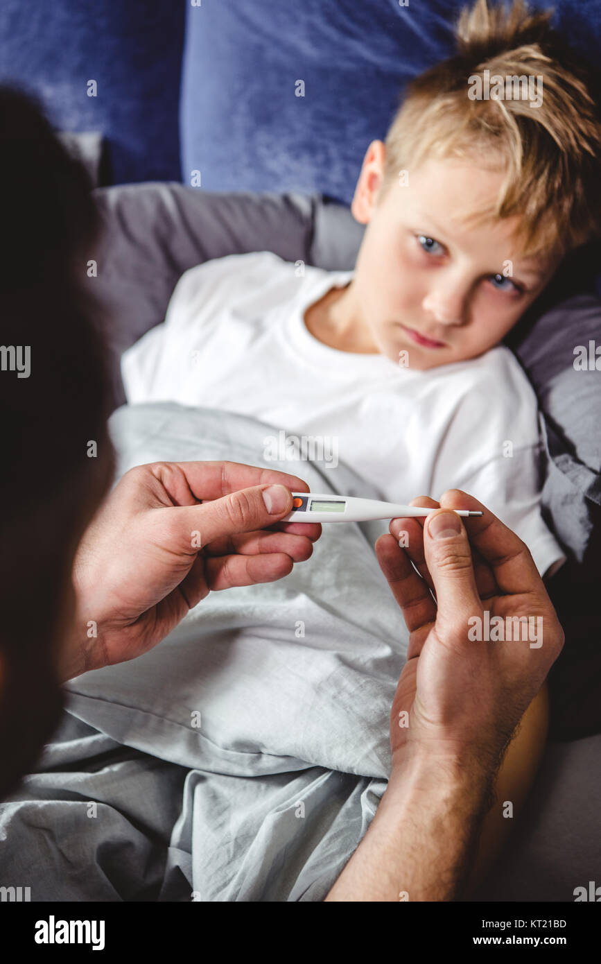 Little boy has a fever Stock Photo - Alamy