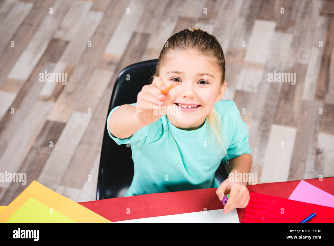 Schoolchild pointing with pencil Stock Photo - Alamy