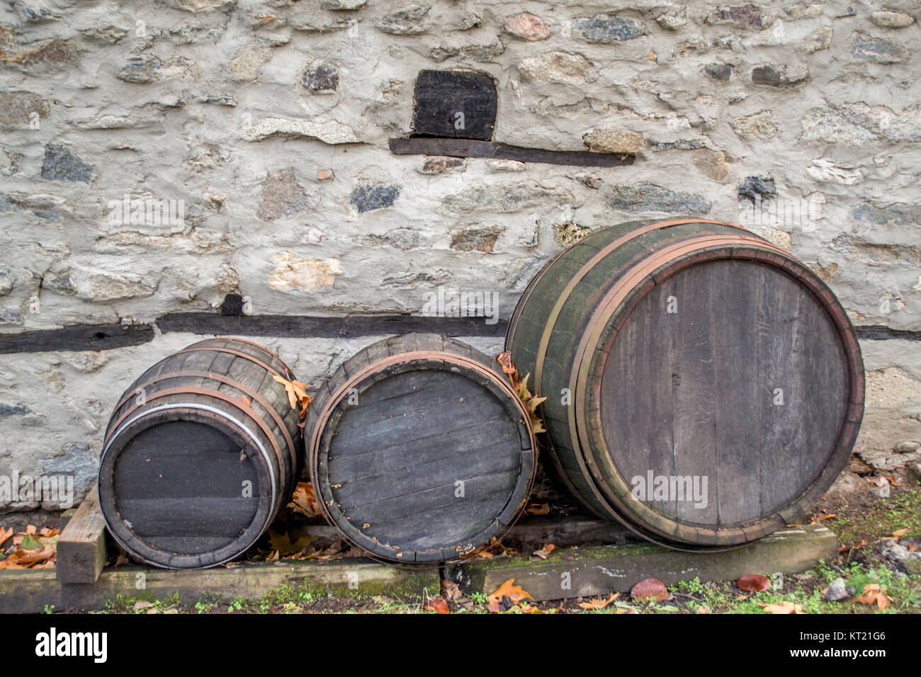 Three barrels on the wall Stock Photo - Alamy