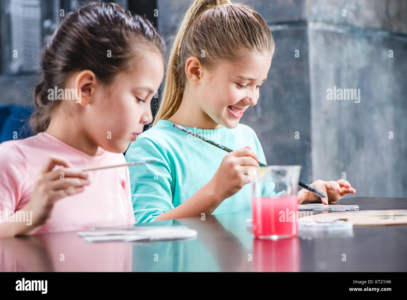Children painting on paper Stock Photo - Alamy