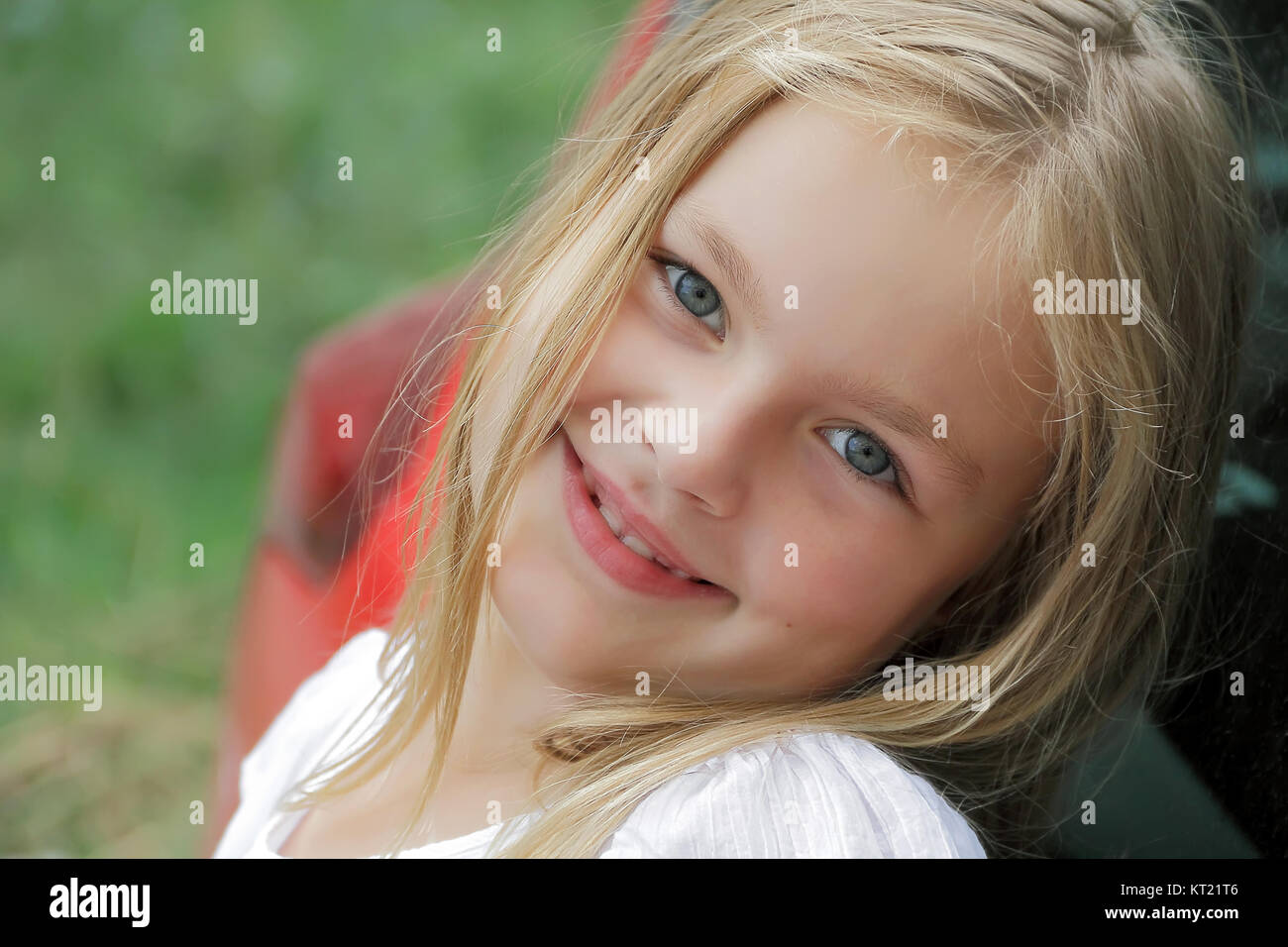 Smiling girl with blue eyes Stock Photo - Alamy
