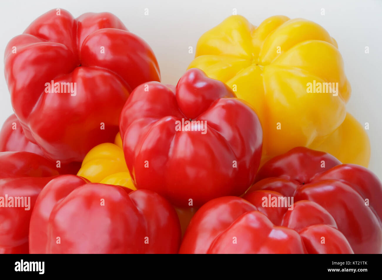 Red and yellow raw pepper Stock Photo - Alamy