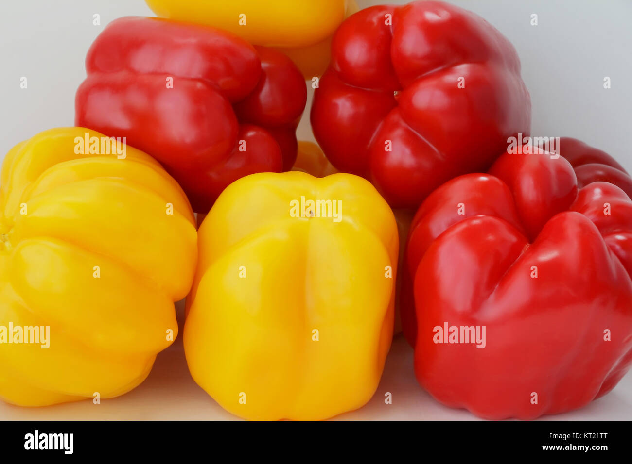 Red and yellow raw pepper Stock Photo - Alamy